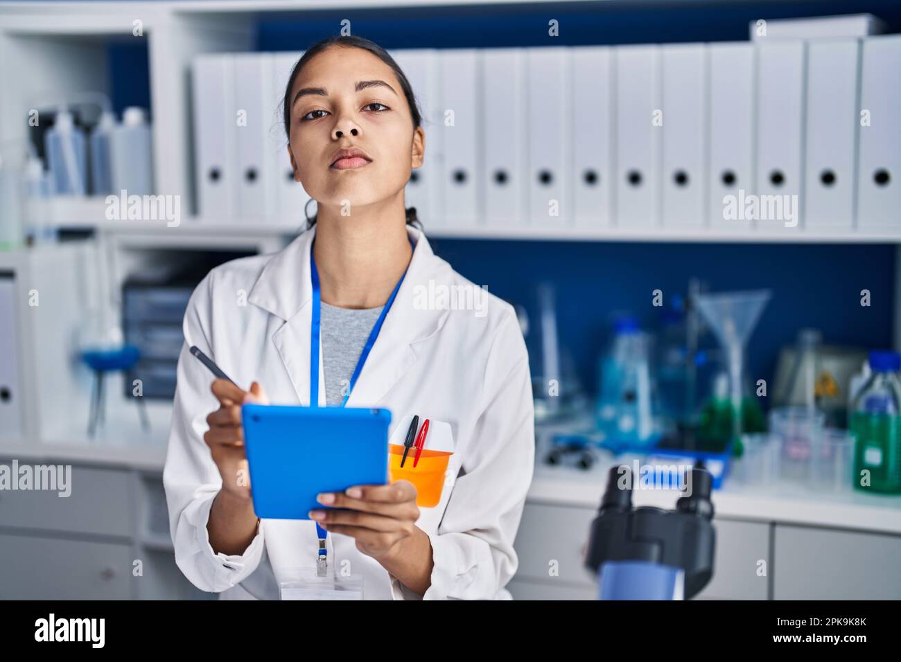 Young african american woman scientist write on touchpad at laboratory Stock Photo - Alamy
