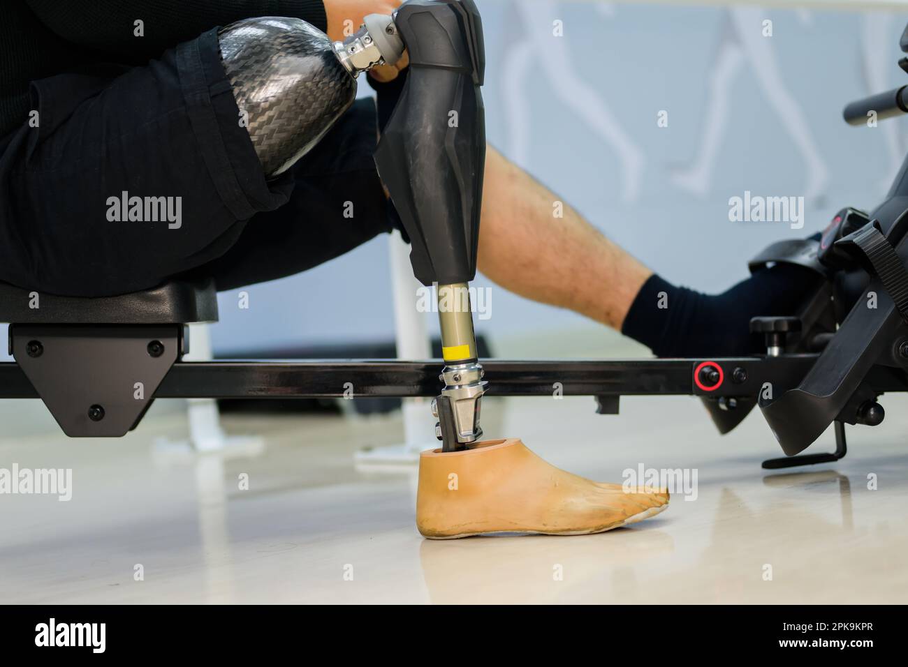 Disabled sporty man exercising with prosthetic leg at gym Stock Photo ...