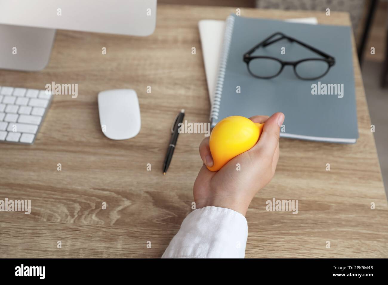 Man squeezing ball desk hi-res stock photography and images - Alamy