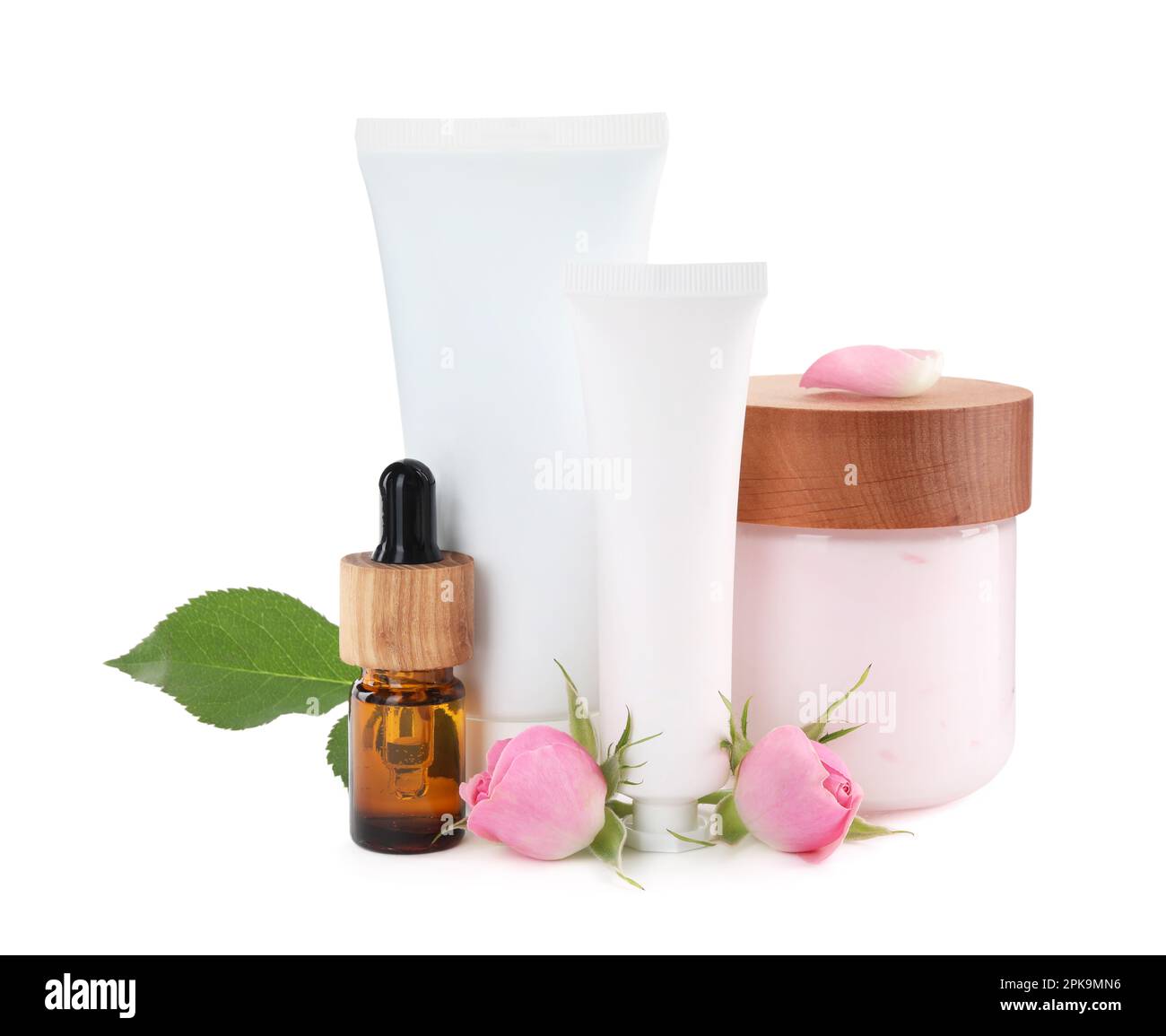 Different hand care cosmetic products and roses on white background ...
