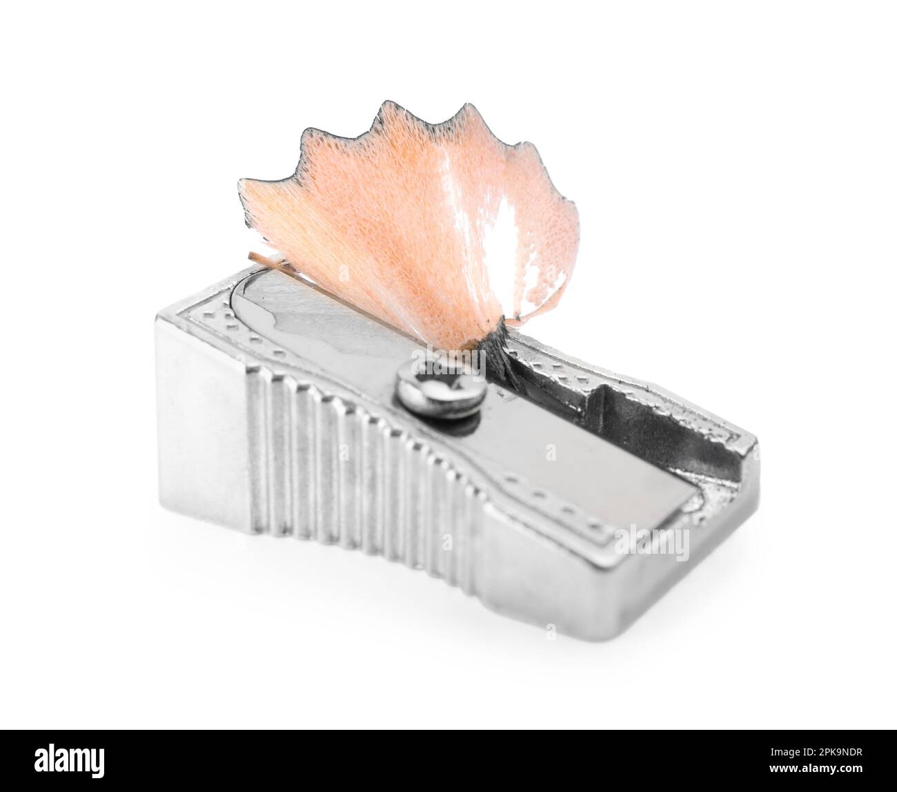 Metal sharpener with pencil shavings on white background Stock Photo ...
