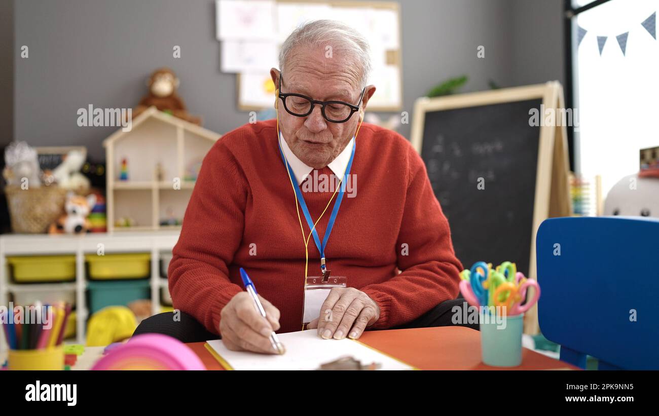 Teacher writing papers classroom hi-res stock photography and images ...