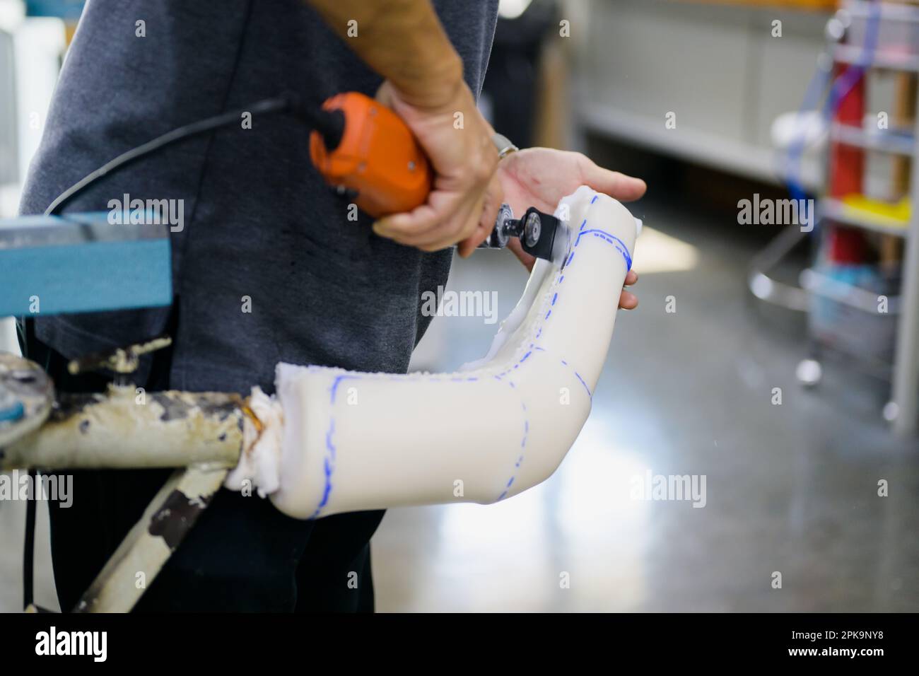 Worker making plaster cast for socket at prosthetic factory Stock Photo - Alamy