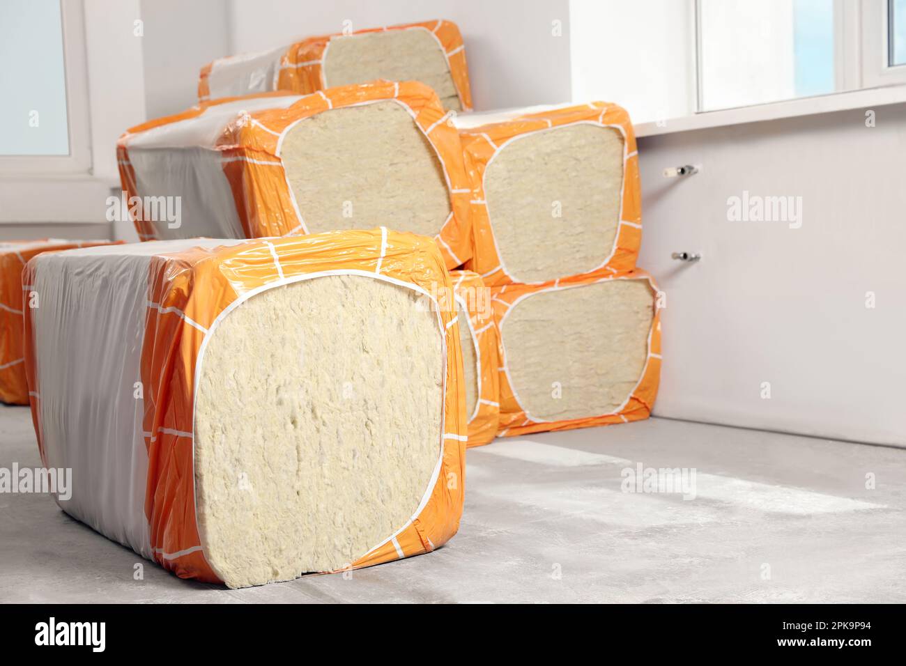 Packages of thermal insulation material in room. Space for text Stock ...