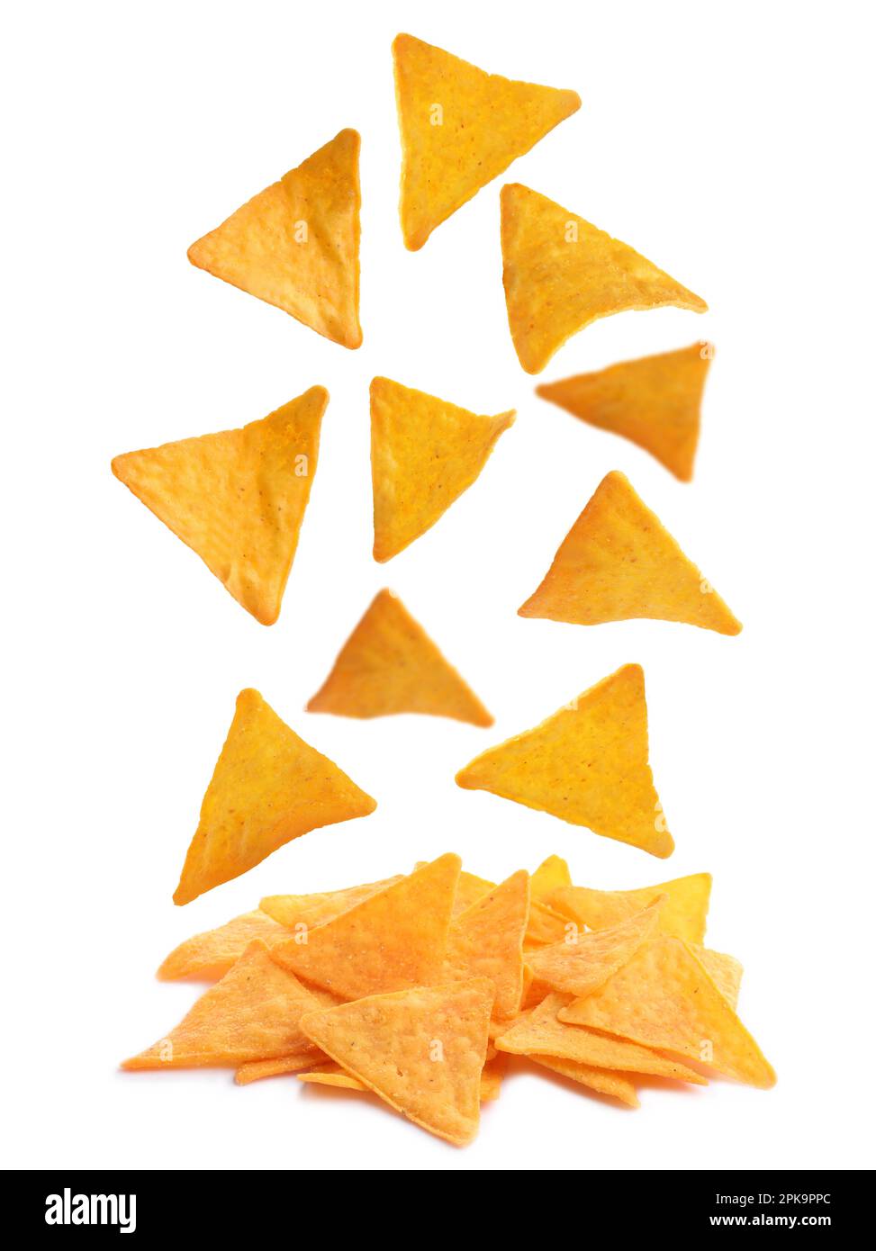Tasty tortilla chips (nachos) falling into pile on white background ...