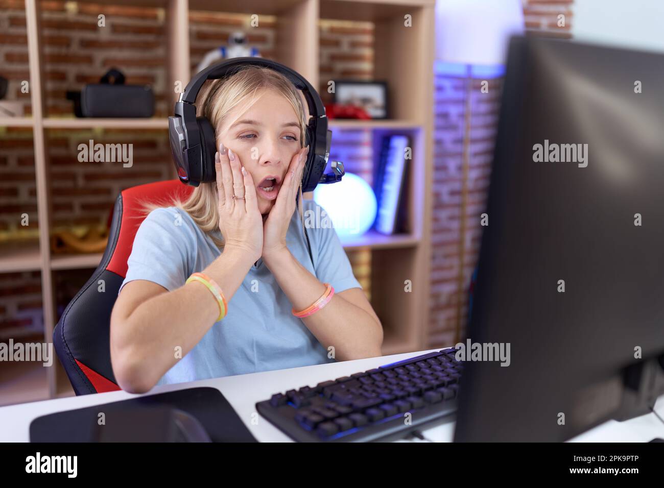 Tired female gamer playing video games hi-res stock photography and ...
