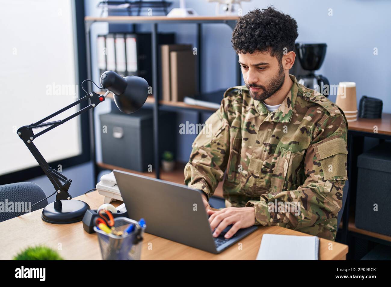 Sitting working army soldier concentration table hi-res stock ...