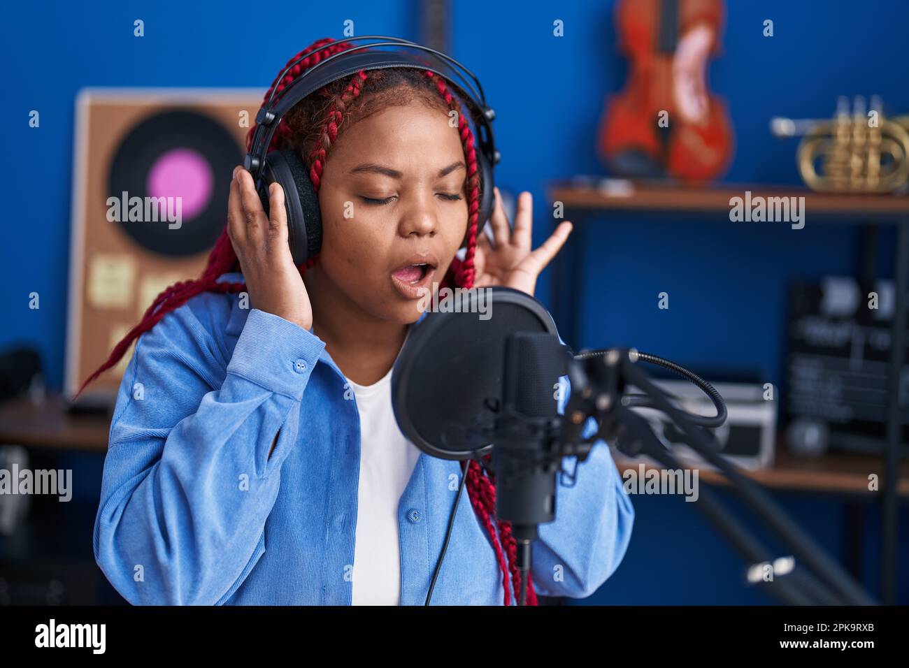 African american woman artist singing song at music studio Stock Photo ...