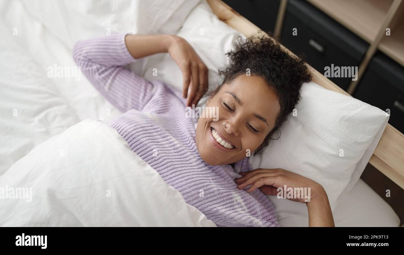 African american woman waking up stretching arms hi-res stock ...
