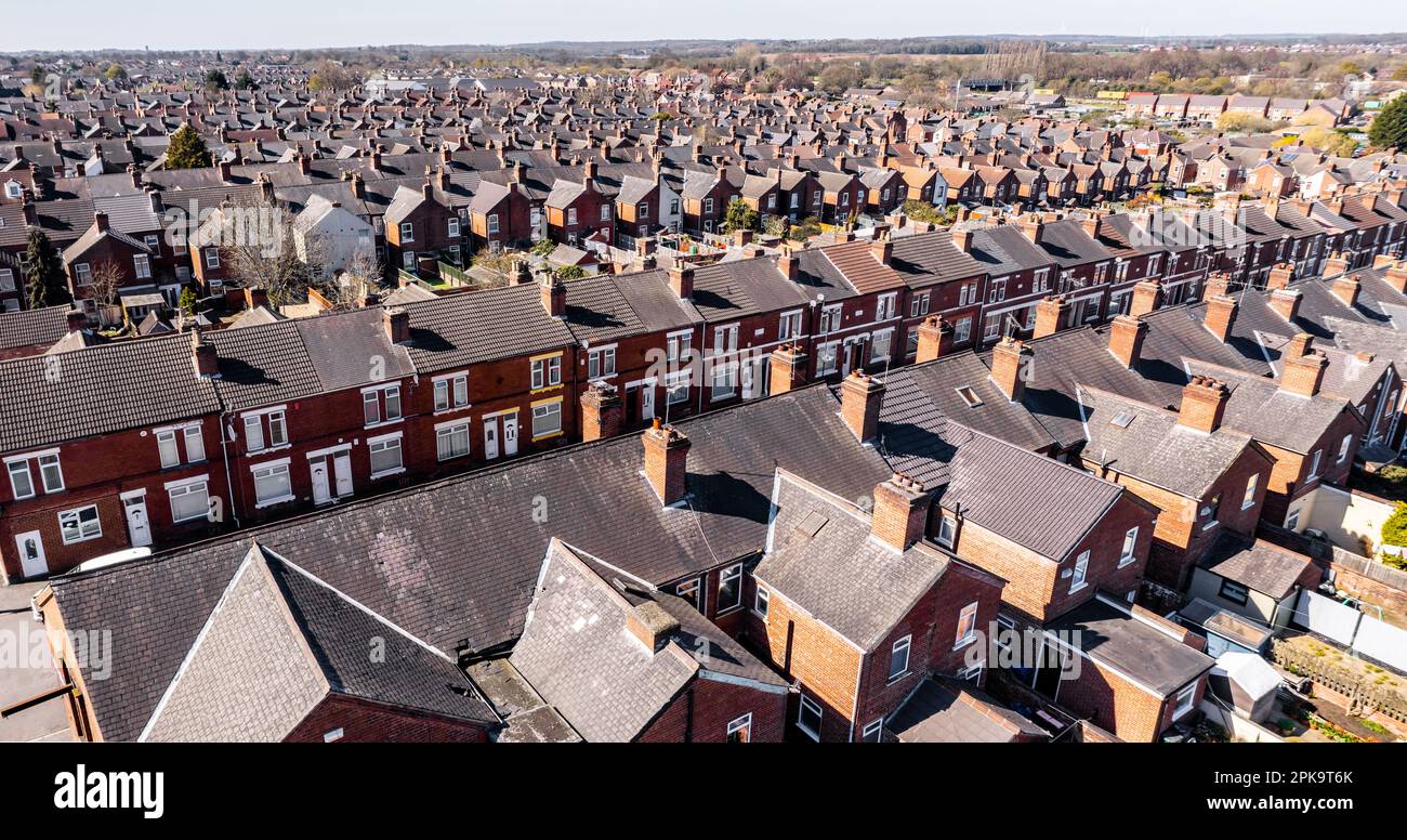 An aerial view above the rooftops of run down back to back terraced ...