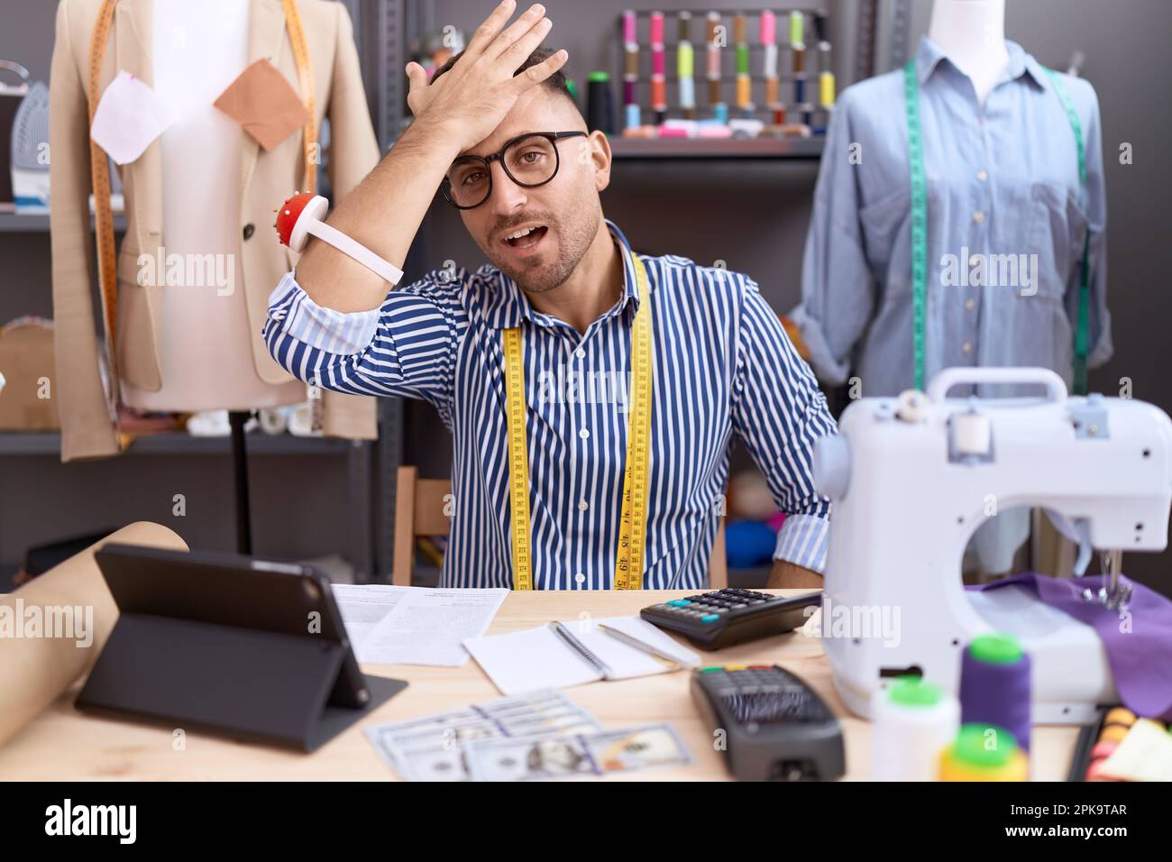 Hispanic man with beard dressmaker designer working at atelier ...