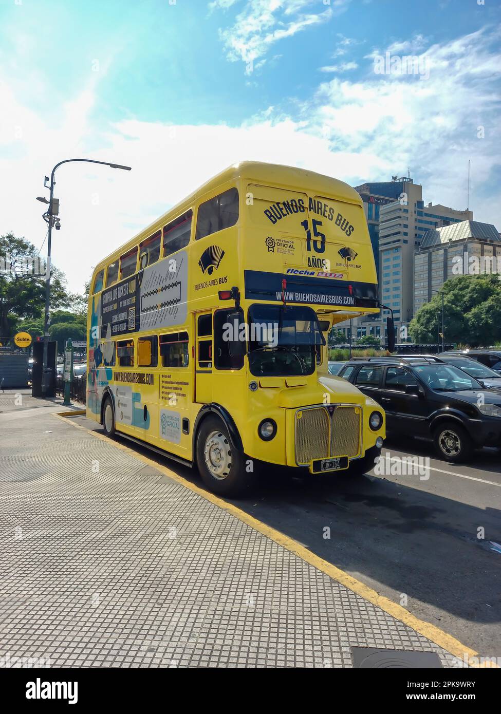 Old yellow double decker touristic bus in the street. Sunny day Stock ...