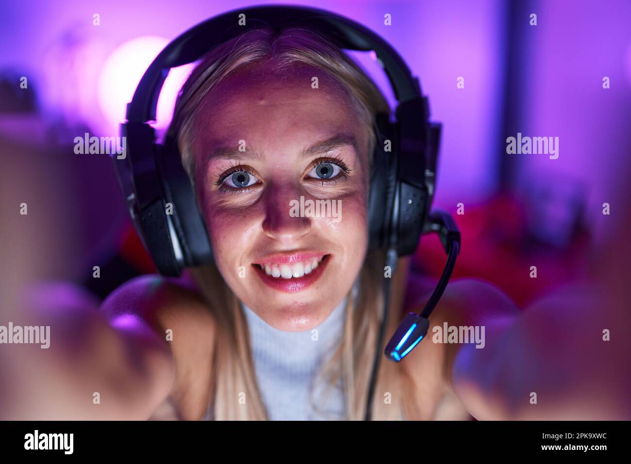 Young blonde woman streamer smiling confident make selfie by camera at ...