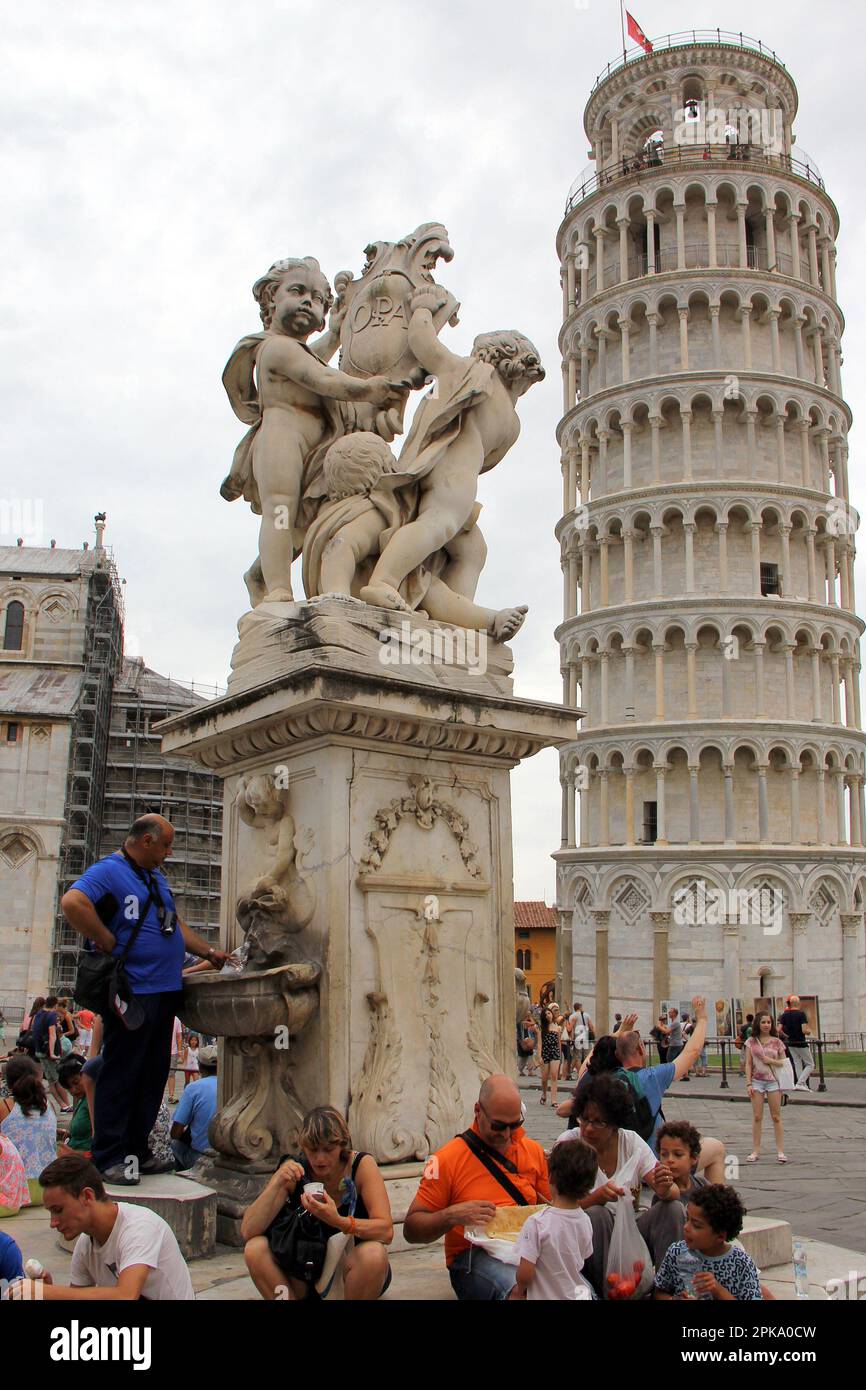 Fountain decorated with sculptures of putti holding a cartouche, in the ...