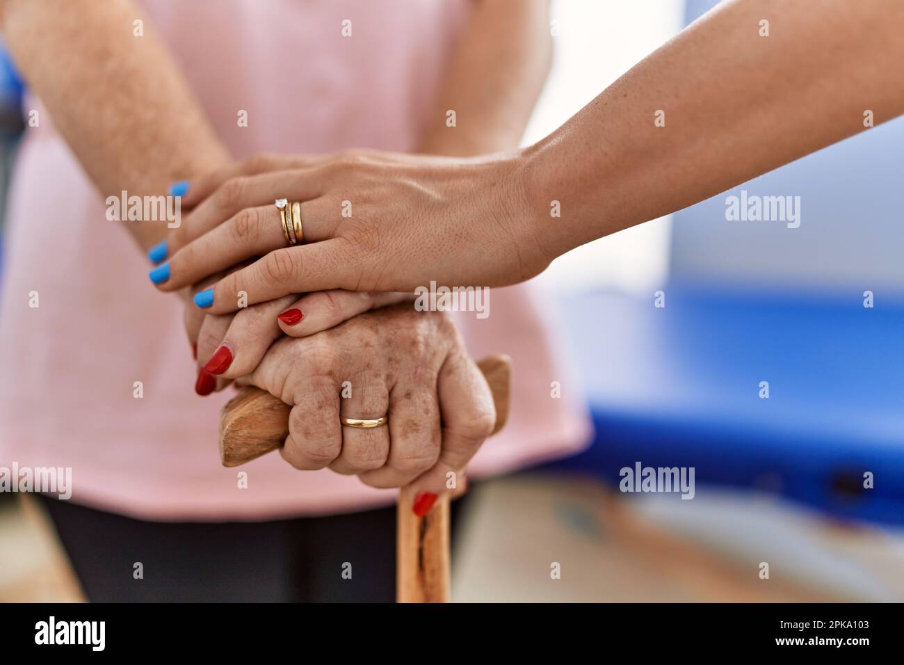 Senior grey-haired woman patient supporting with walking stick at ...