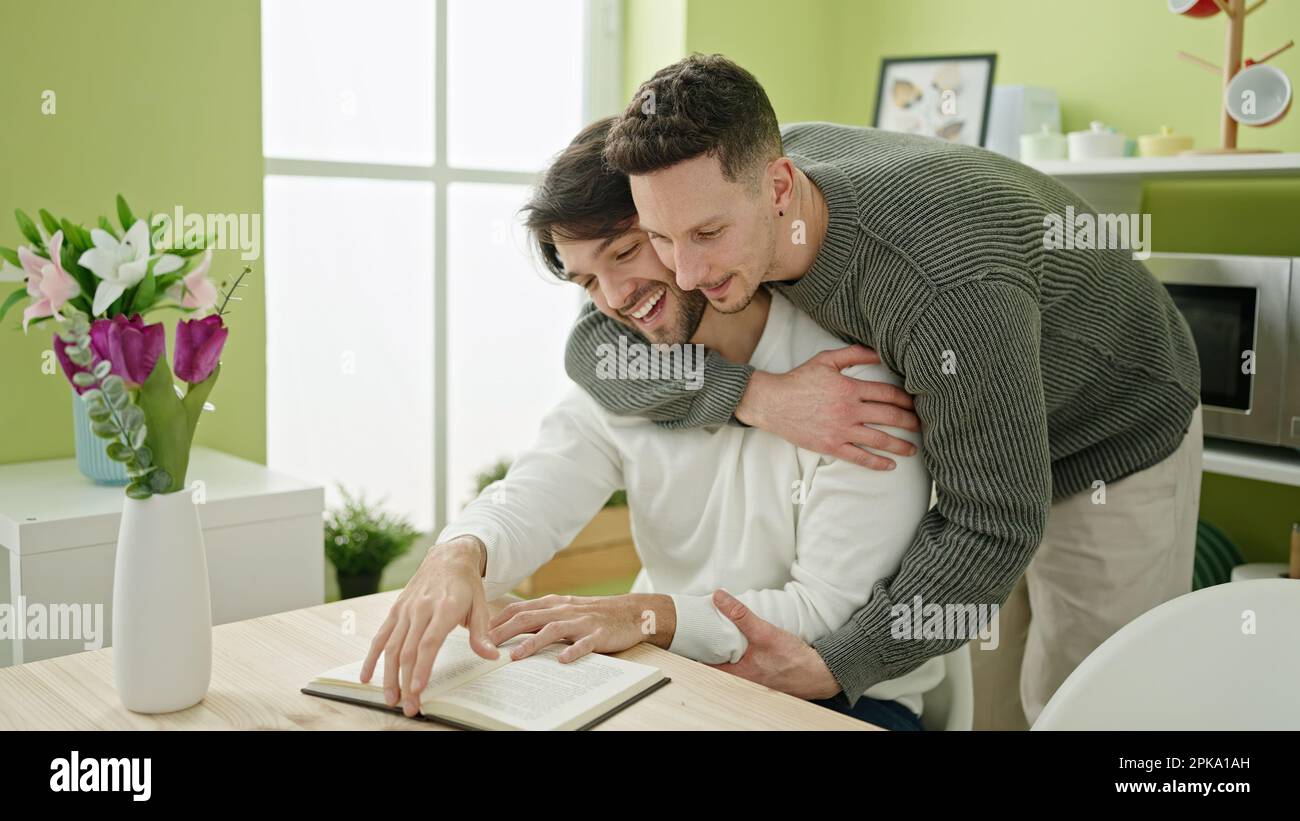 Two gay men sitting table hi-res stock photography and images - Alamy