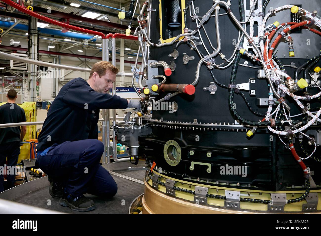 28.02.2023, Germany, Brandenburg, Dahlewitz - An employee assembling a ...