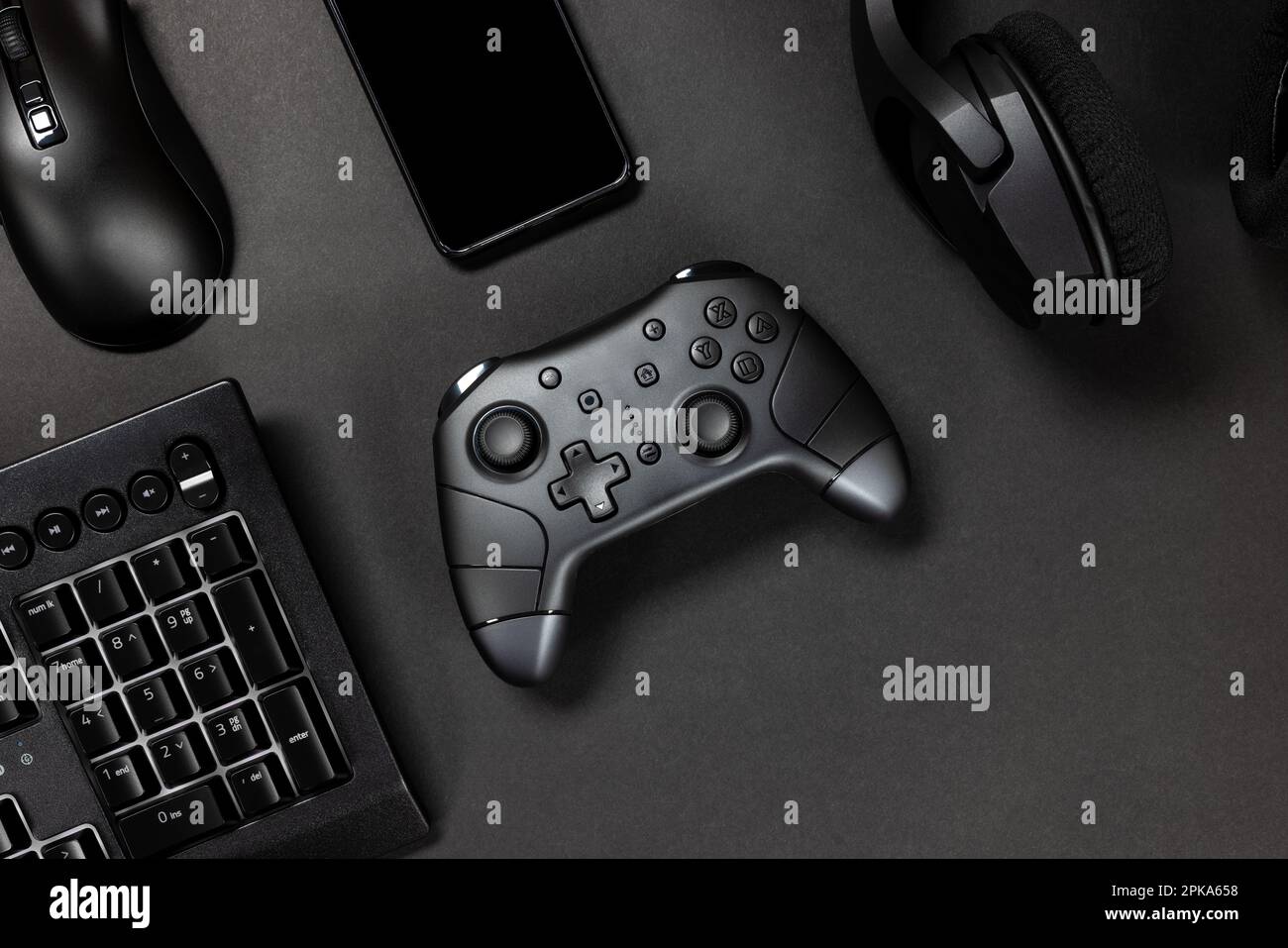 Overhead view of game controller with gadgets like keyboard, mouse ...