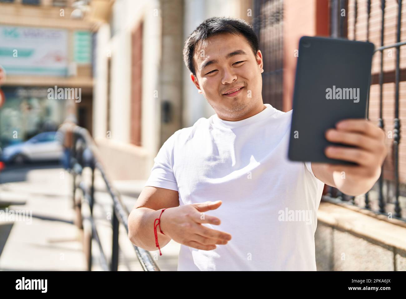 Young chinese man smiling confident having video call at street Stock ...