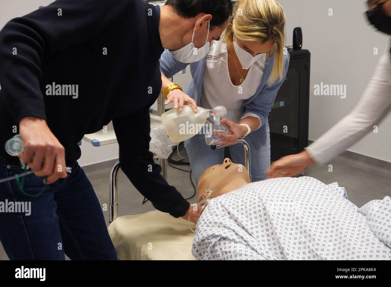 Resuscitation training on a male dummy with a respiratory aid Stock ...