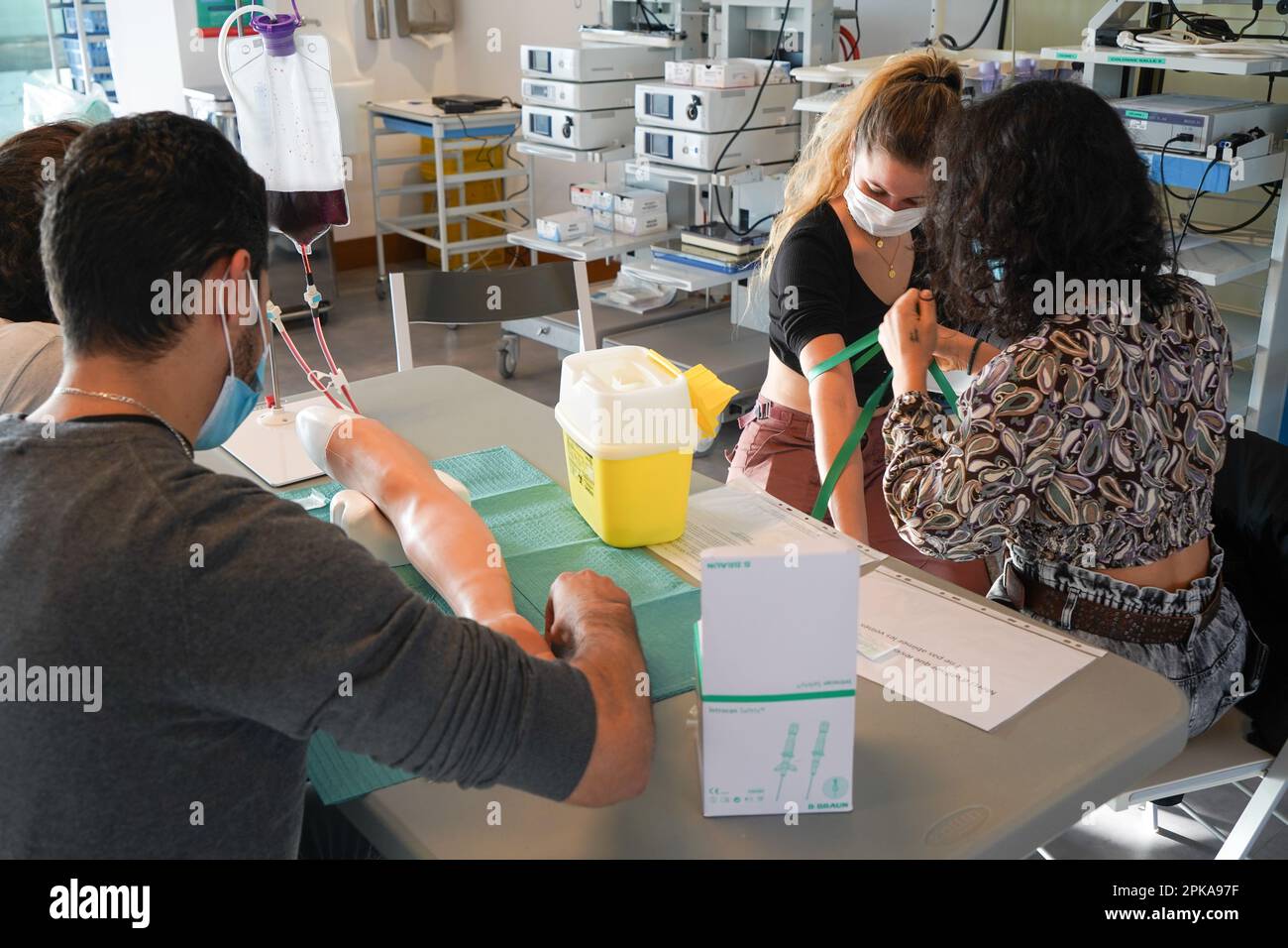 5th year medical students during an IV placement workshop. Students ...