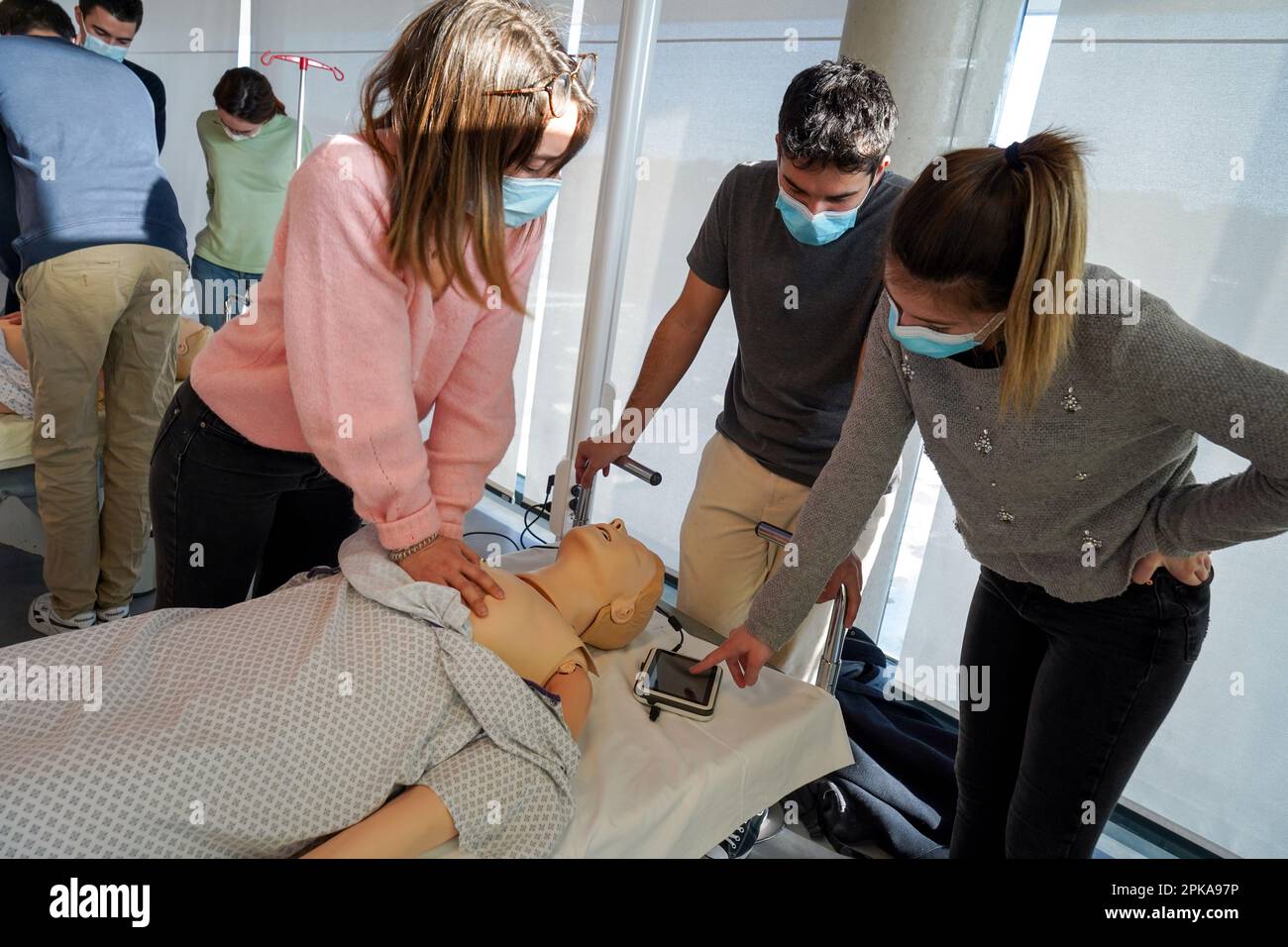 5th year medical students during a SimMan dummy cardiac massage ...