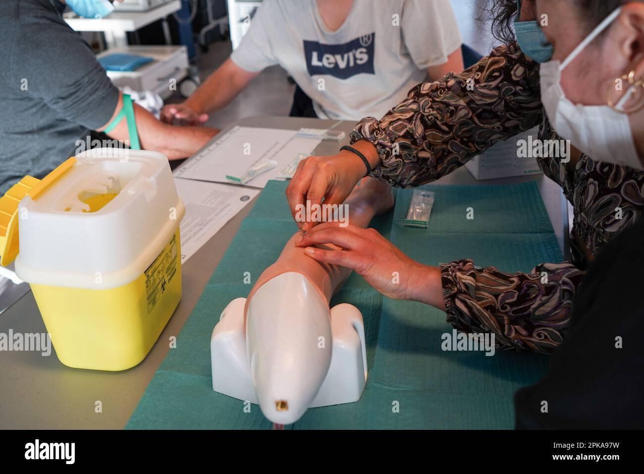 5th year medical students during an IV placement workshop. Students ...