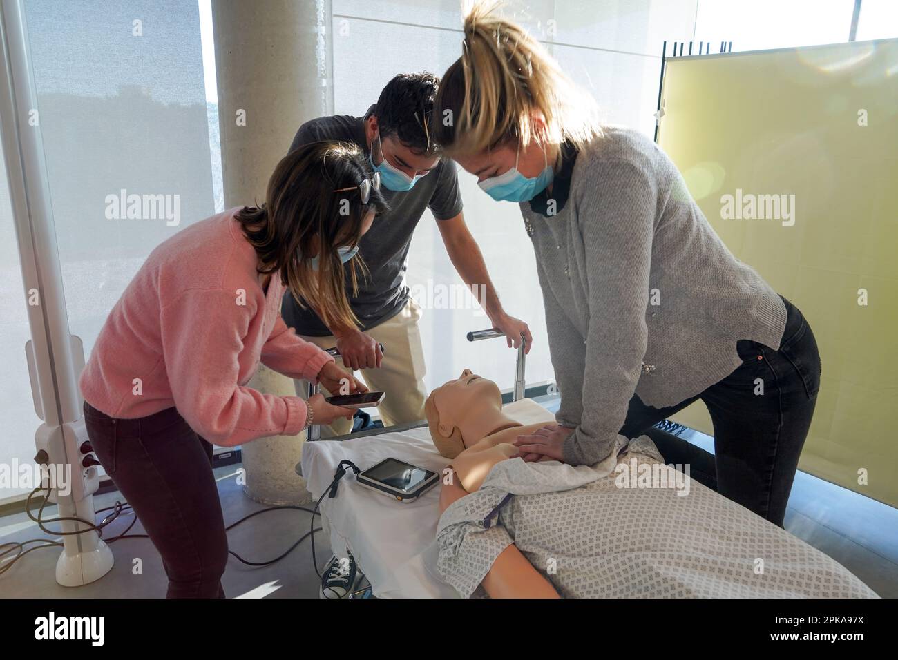 5th year medical students during a SimMan dummy cardiac massage ...