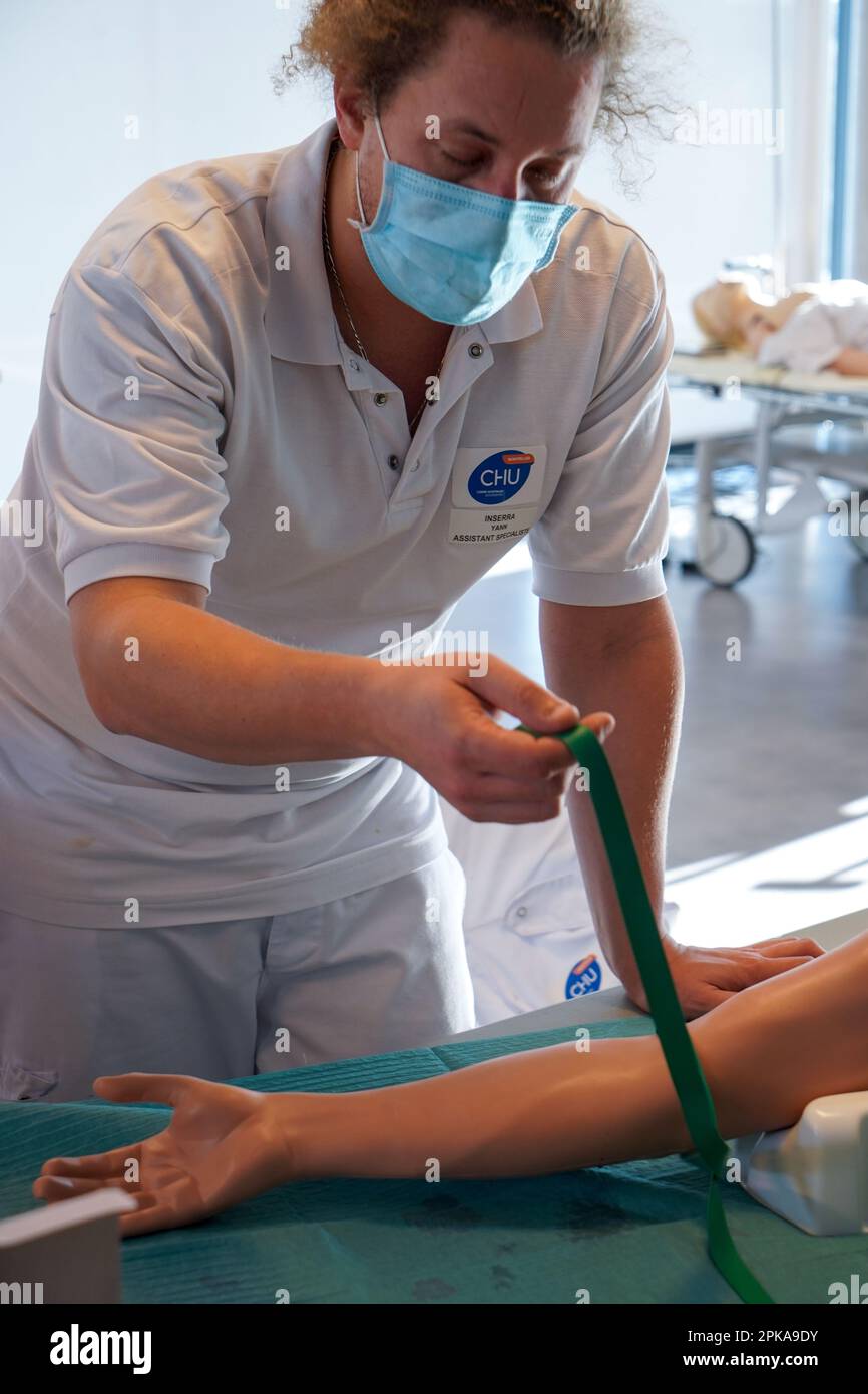 5th year medical students during an IV placement workshop. Students ...