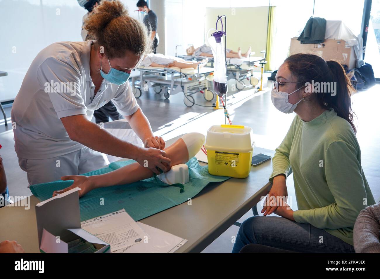 5th year medical students during an IV placement workshop. Students ...