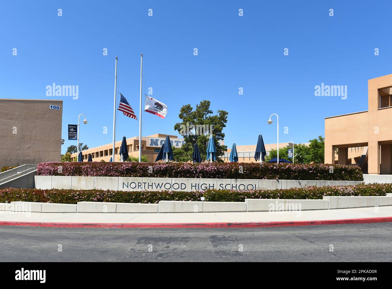 IRVINE, CALIFORNIA - 2 APR 2023: Main entrance sign on the campus of ... IRVINE, CALIFORNIA - 2 APR 2023: Main entrance sign on the campus of ...