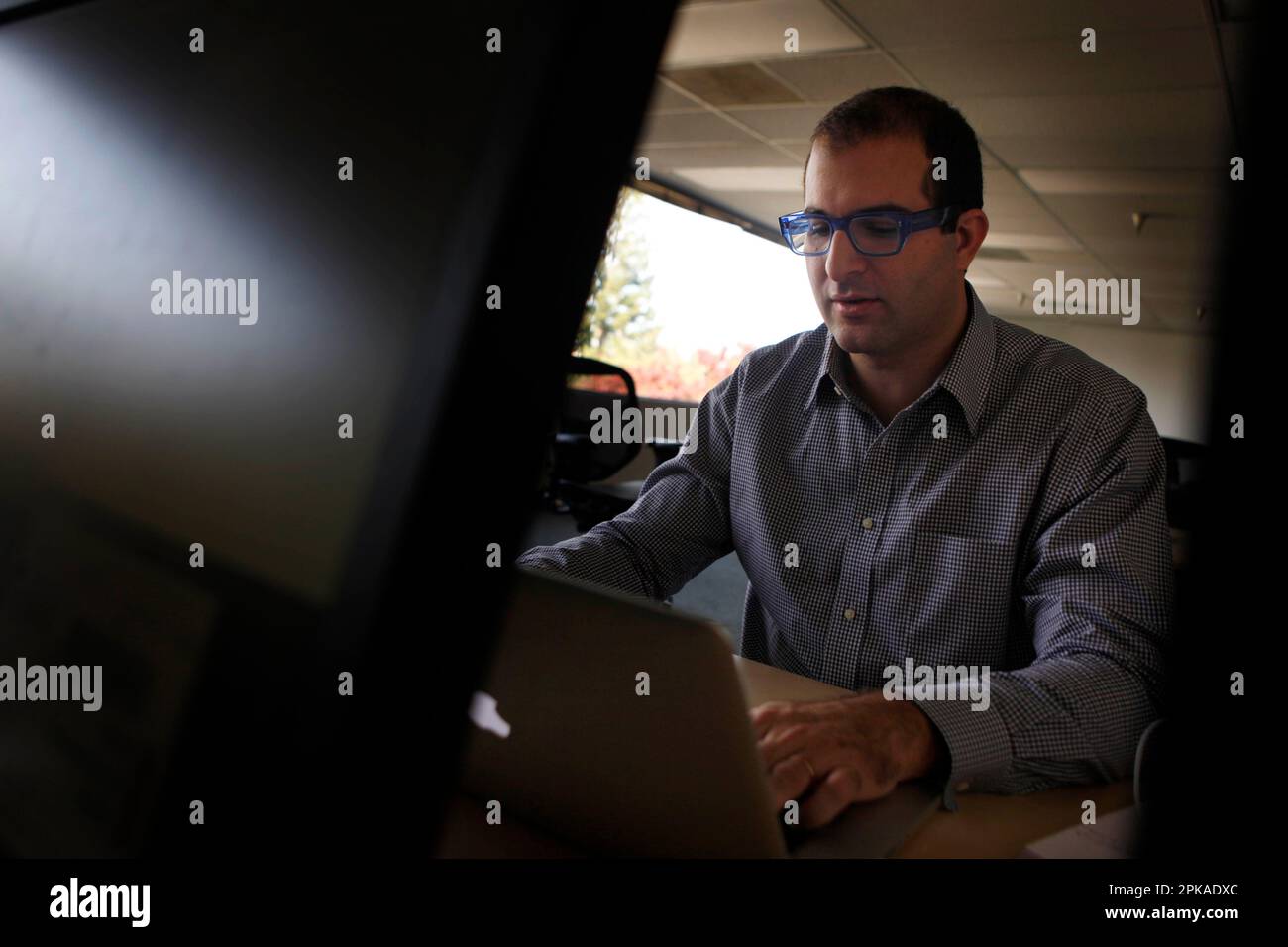 Philip Kaplan, Blippy co-founder, works on a laptop at Blippy ...