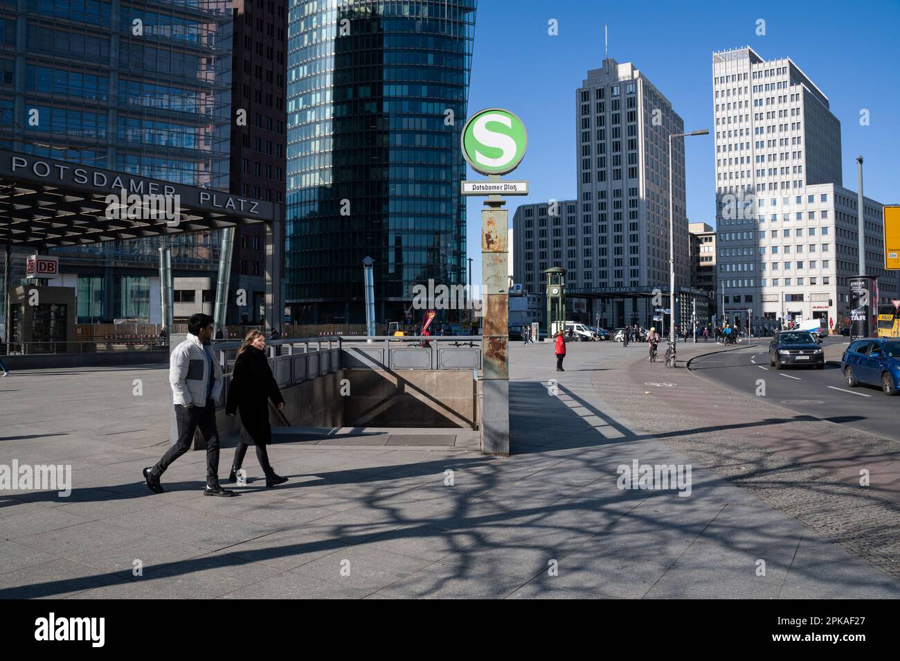 28.02.2023, Germany, , Berlin - Europe - People walk between high-rise ...