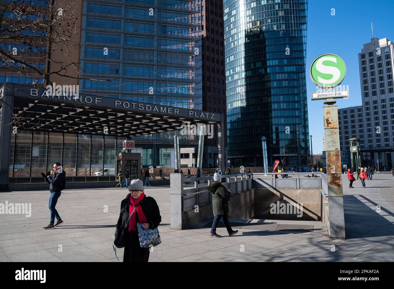 28.02.2023, Germany, , Berlin - Europe - People pass between the high ...