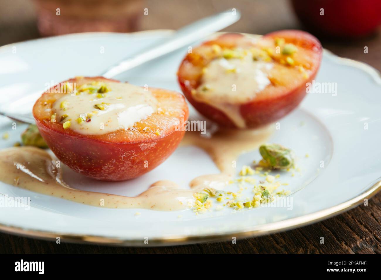Grilled Plums with Maple Cinnamon Soy Yogurt and Pistachios Stock Photo ...