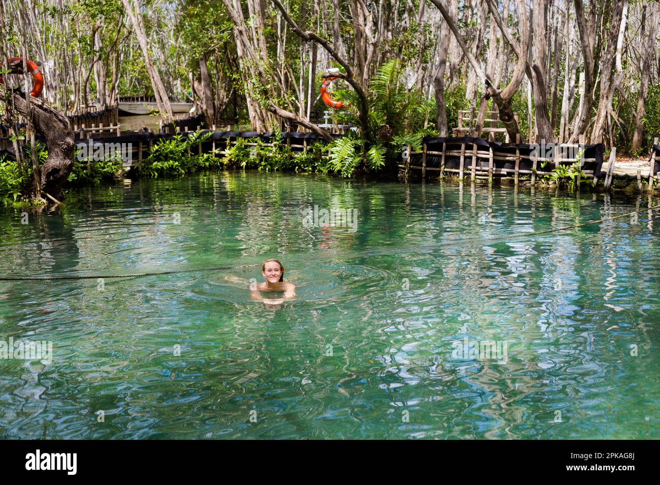 Pretty young caucasian female tourist swimming in El Corchito ...