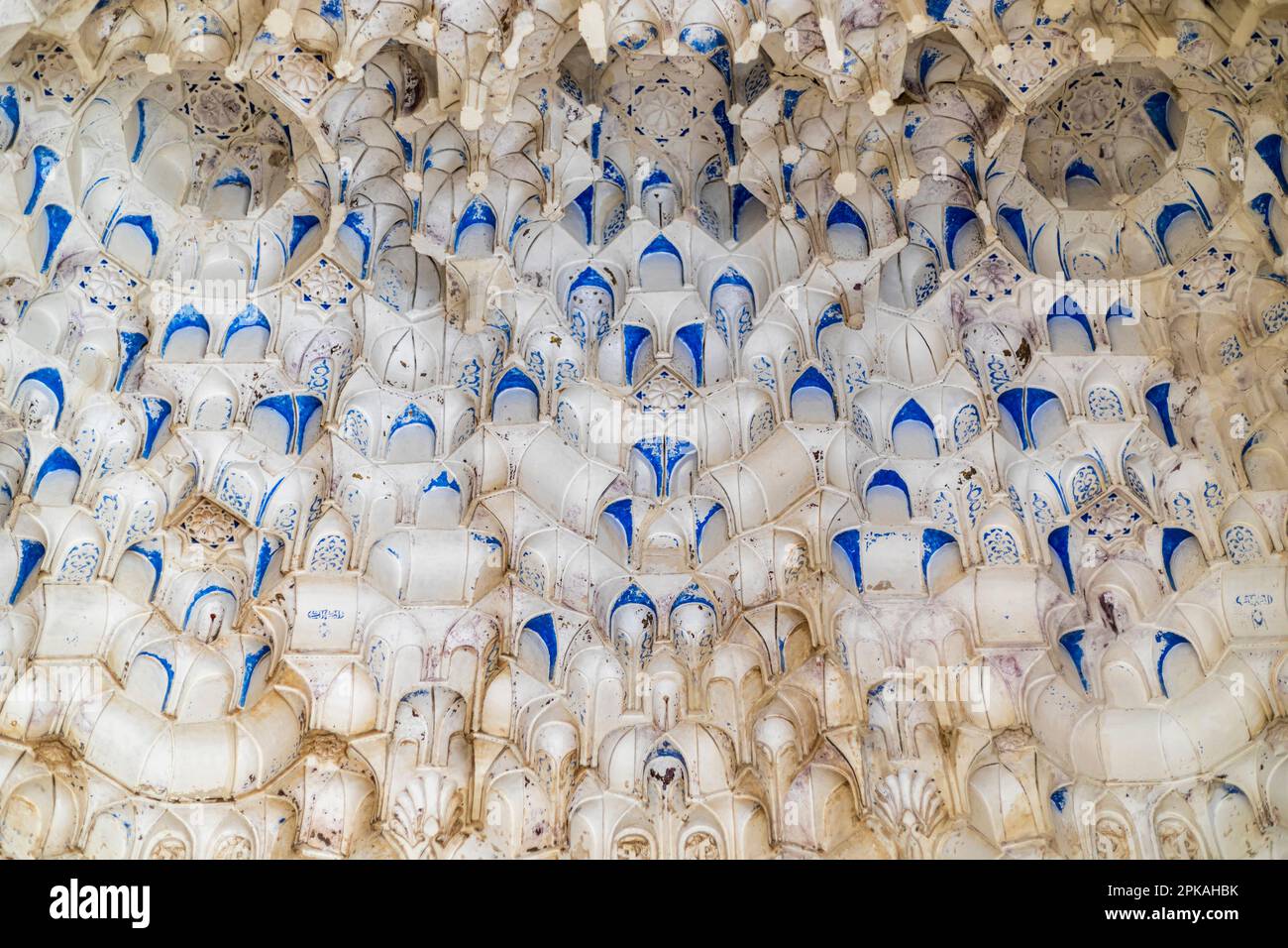 Detail of dome with decorated medieval muqarnas in La Alhambra in ...