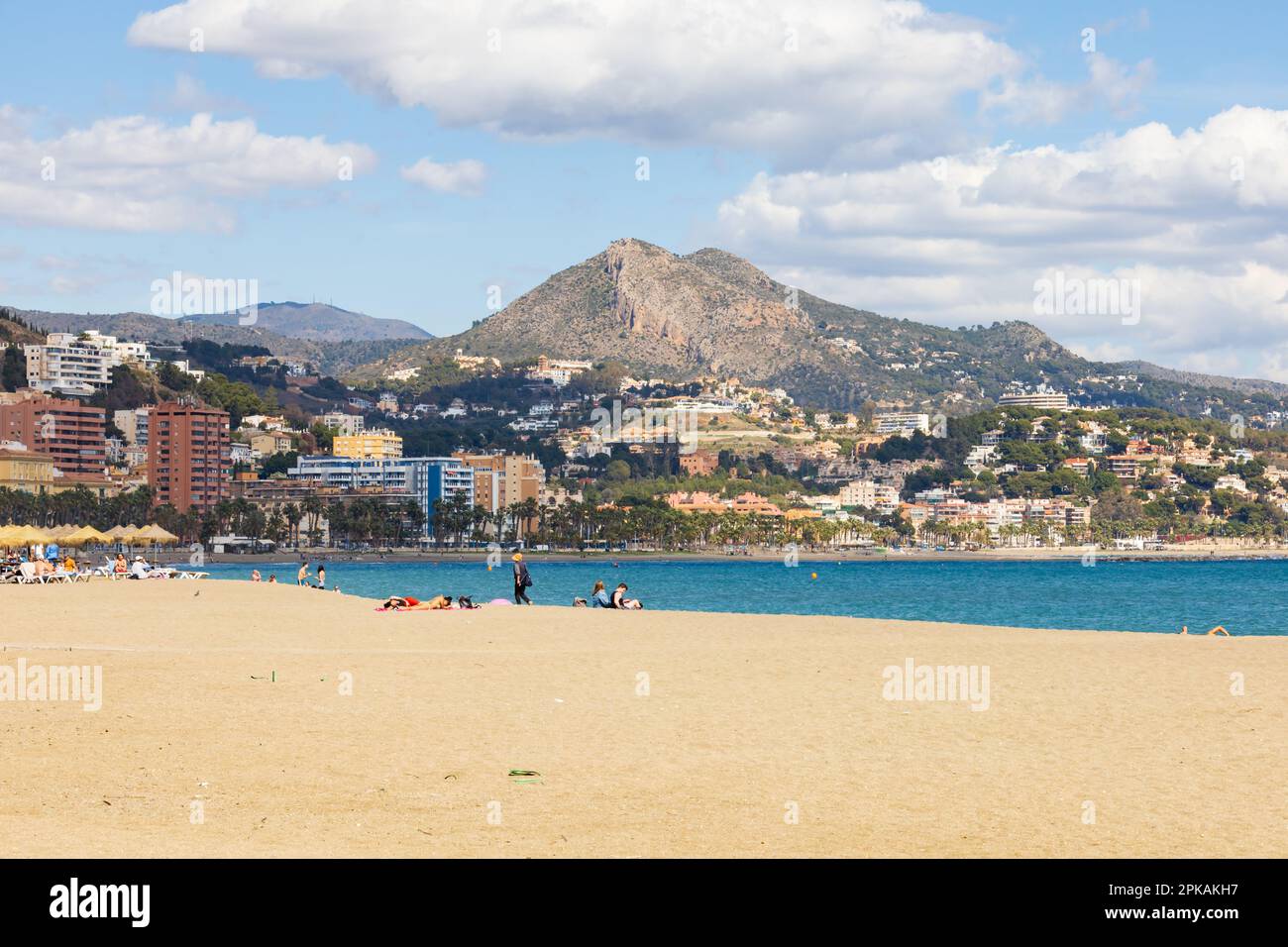 Playa la Malagueta beach with the Monte Malaga mountains behind. People ...