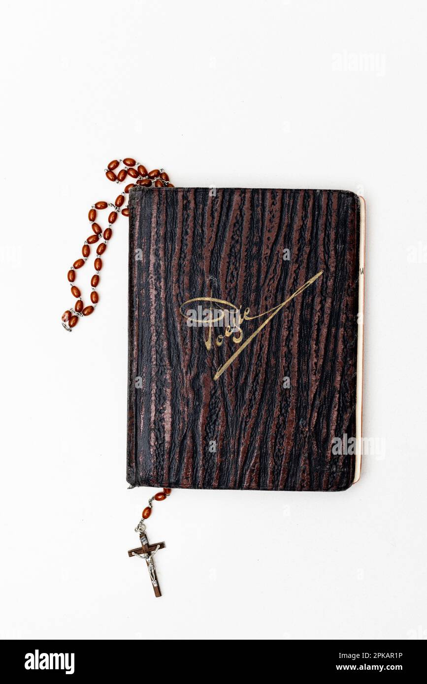 Old poetry album with a rosary between the pages of the book Stock ...