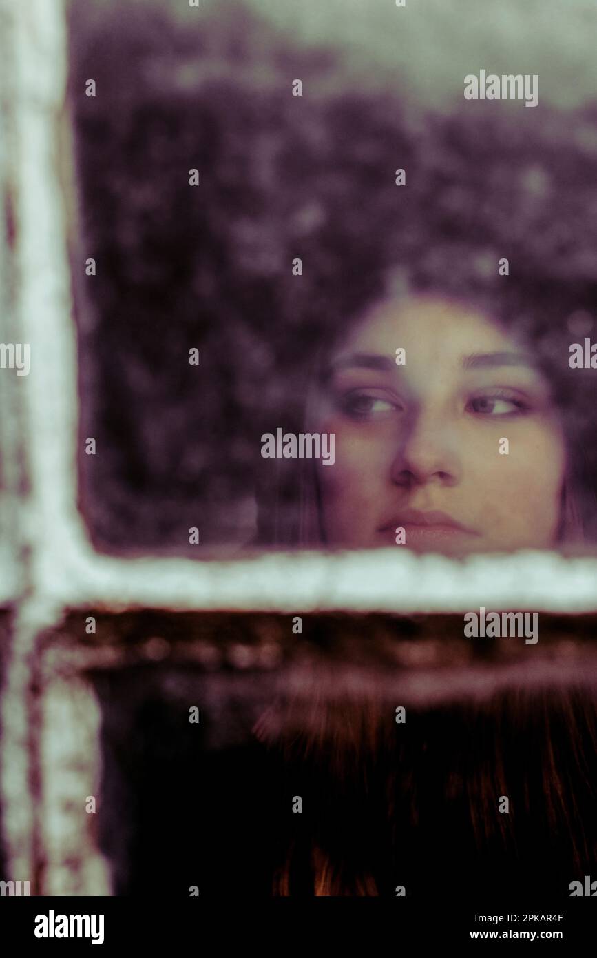 Girl behind old muntin window Stock Photo - Alamy