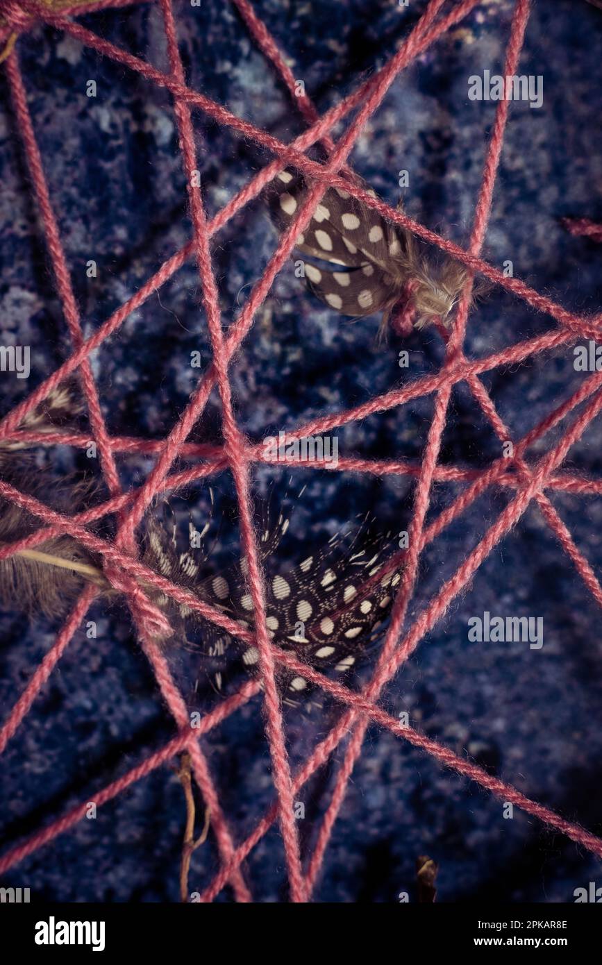 Cross and cross stretched string with springs Stock Photo - Alamy