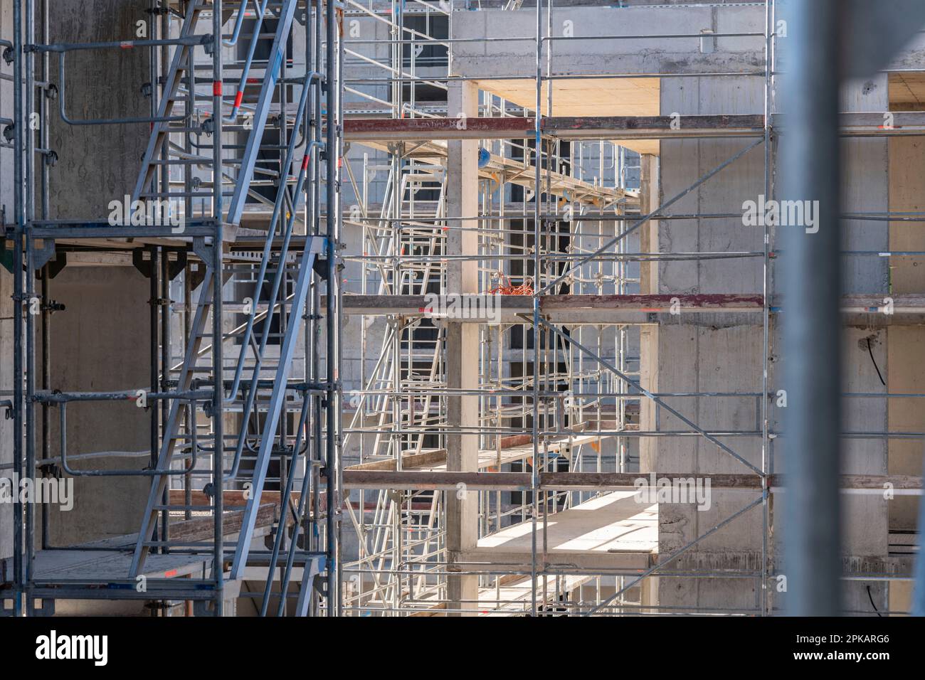 Detail of facade of scaffolded multi-storey building in shell with ...