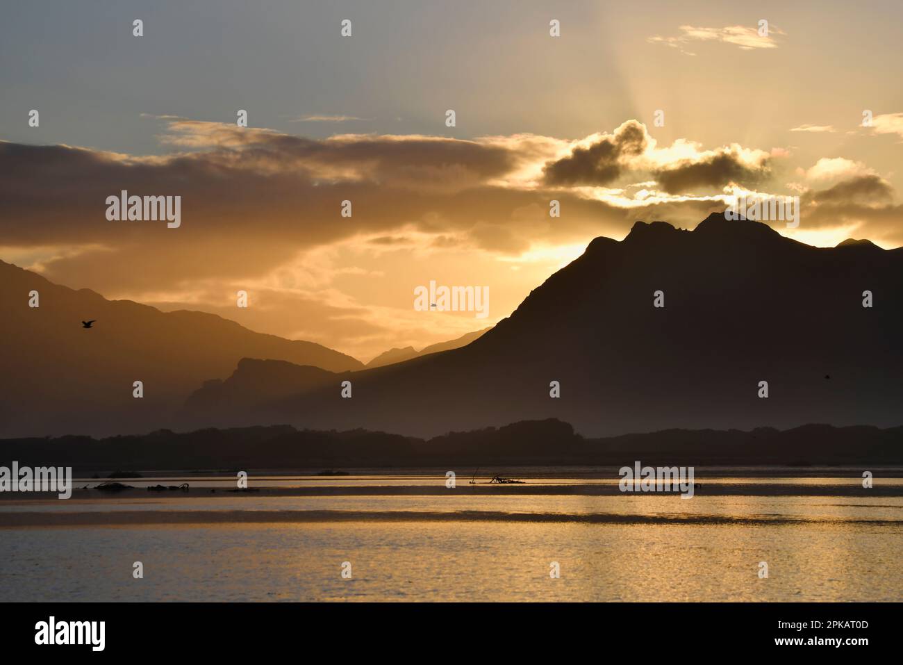 Hazy sunset over water hi-res stock photography and images - Alamy