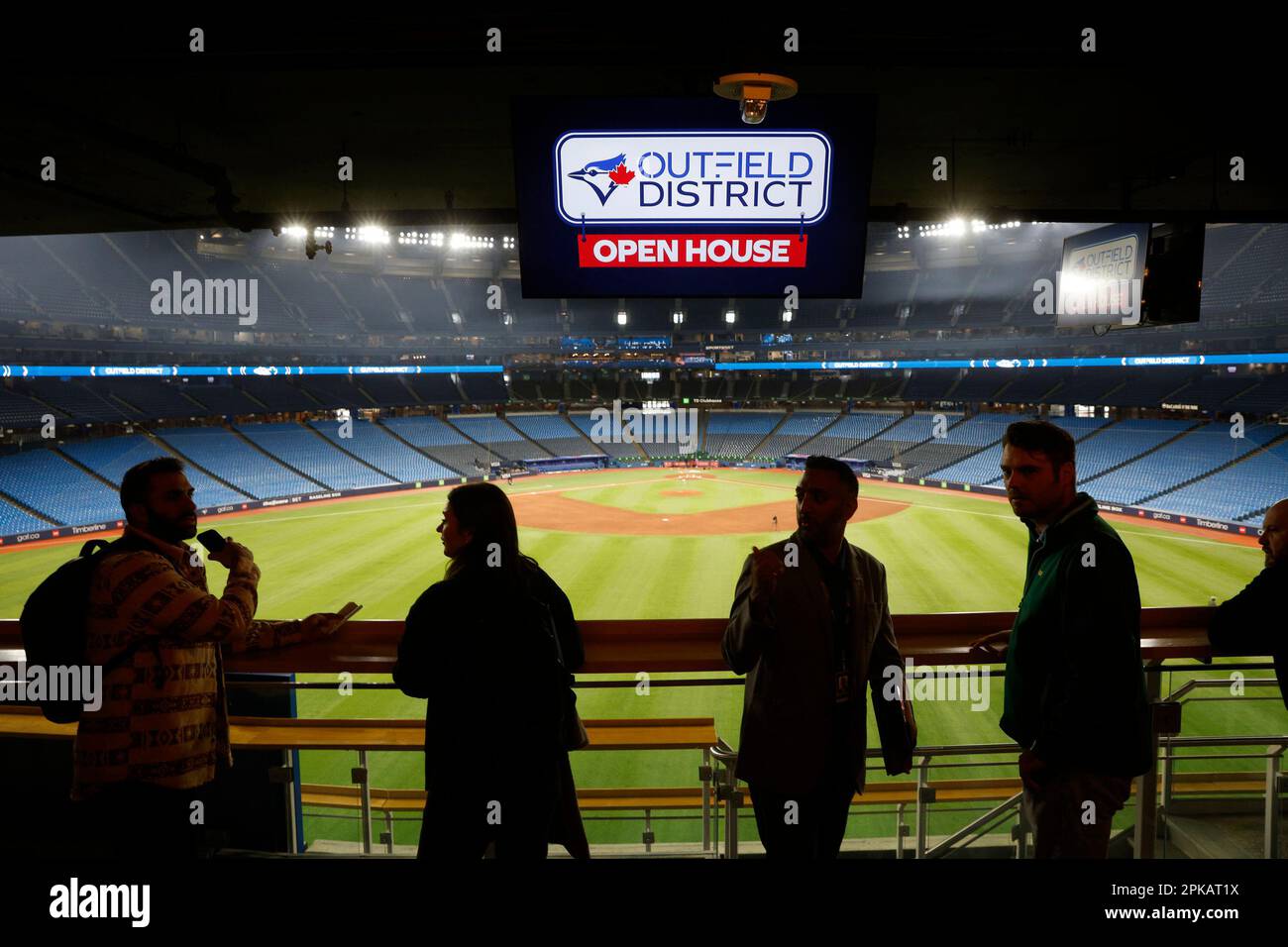 People are shown at the Corona Rooftop Patio during a tour of new ...