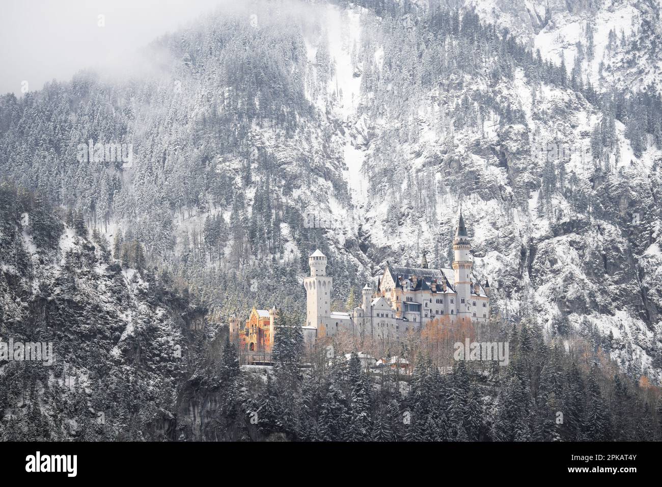 View of cloud covered neuschwanstein castle hi-res stock photography ...