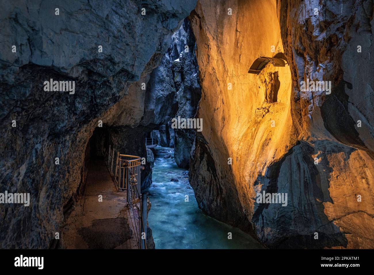 Illuminated statue of the virgin mary in partnachklamm gorge garmisch ...
