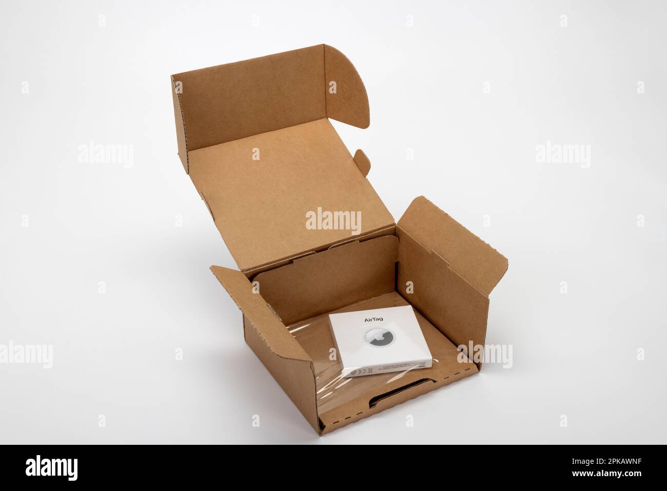 Apple AirTag in shipping box, opened, original packaging, icon image ...