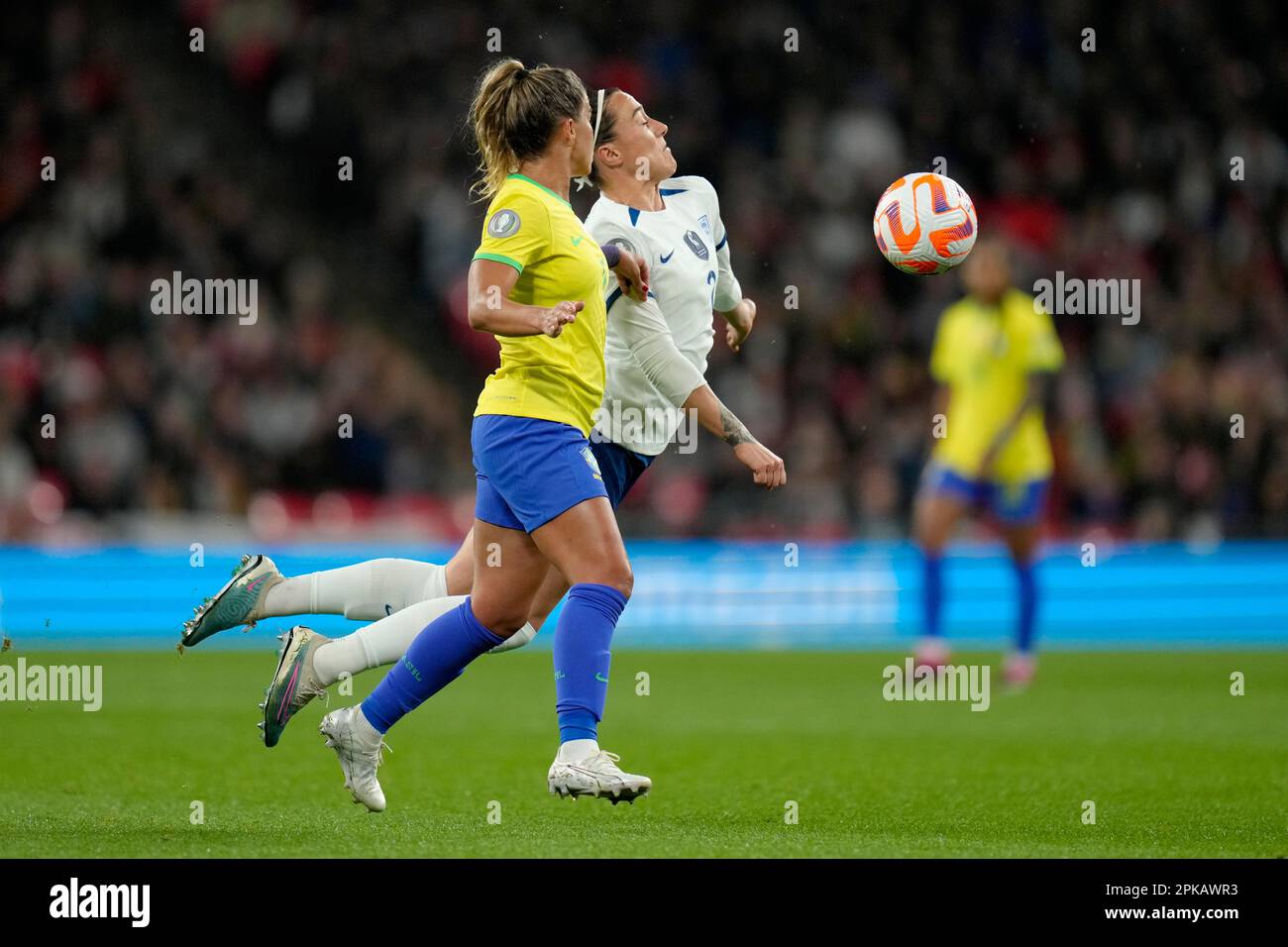 Brazil's Luana, left, vies for the ball with England's Lucy Bronze ...