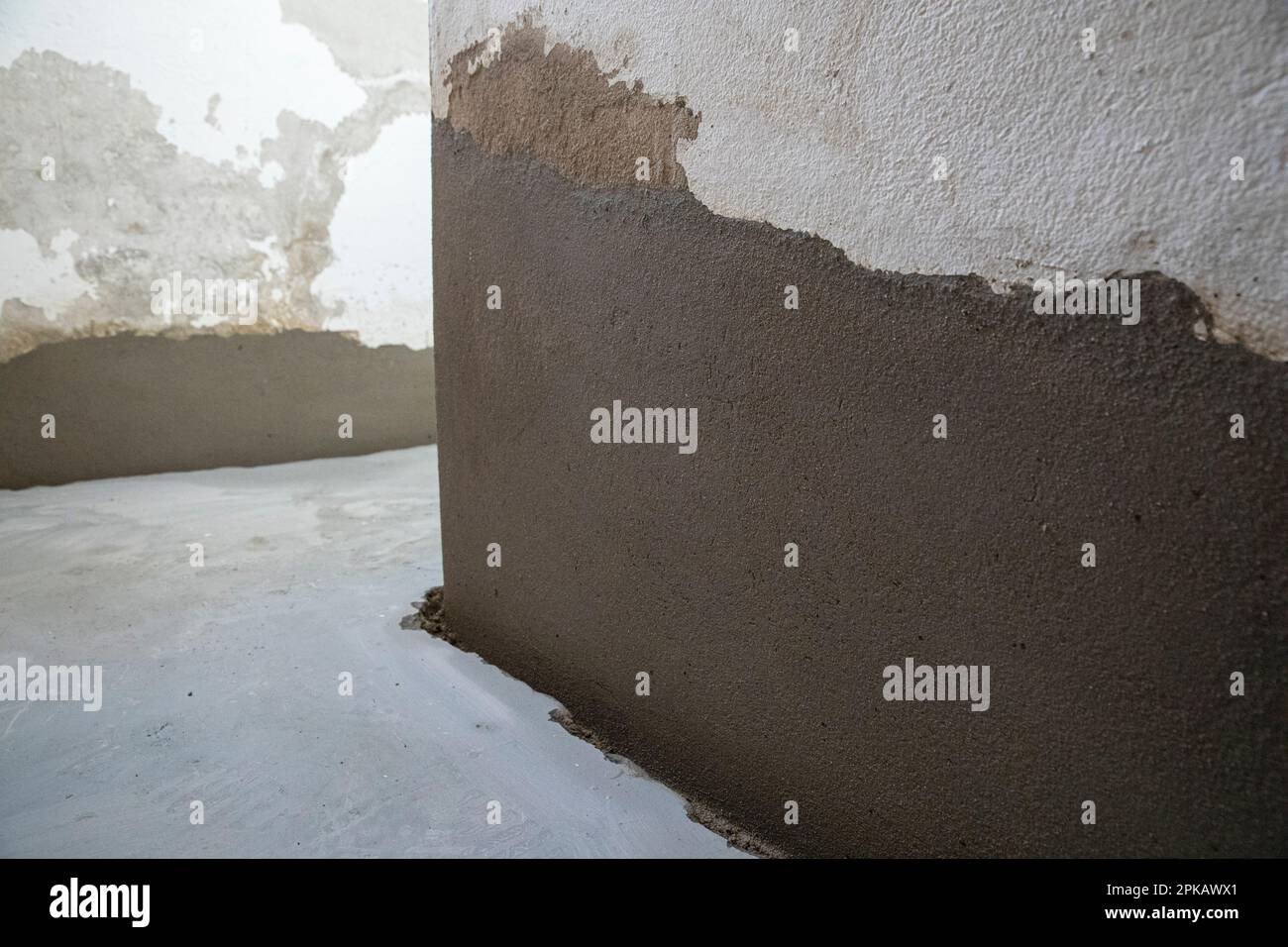 Plastered basement wall inside, masonry renovation, symbol image ...