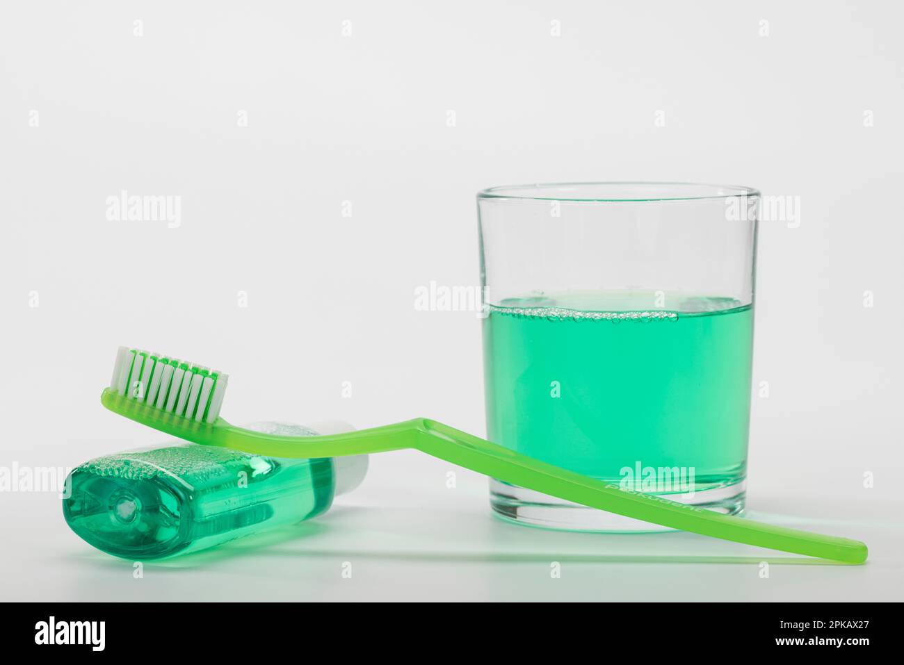 Toothbrush jar filled with mouthwash, manual toothbrush, symbol image ...